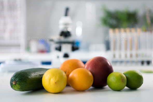 Scientific tools and fruits at workplace in modern biological ...