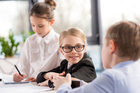 Children working in office like adult business people Stock Photo by ...