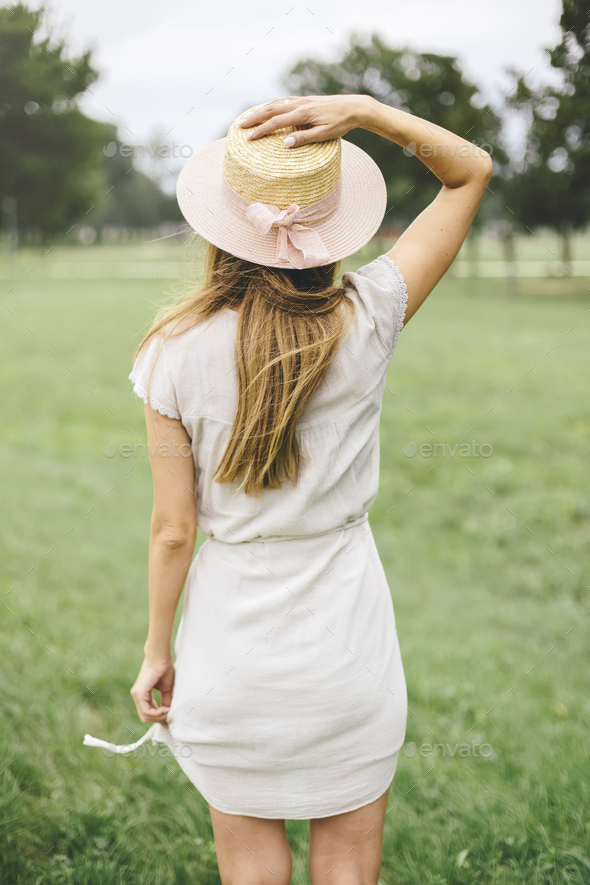 Back view at young woman who wearing hat Stock Photo by BGStock72 ...