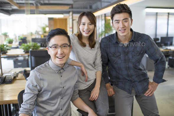 IT workers standing in office Stock Photo by bluejeanimages | PhotoDune
