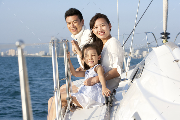 Happy family sitting on the deck Stock Photo by bluejeanimages | PhotoDune