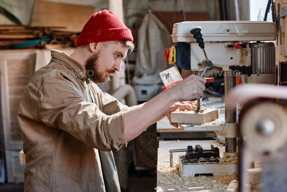 Man Using Drill Press Stock Photo by AnnaStills | PhotoDune