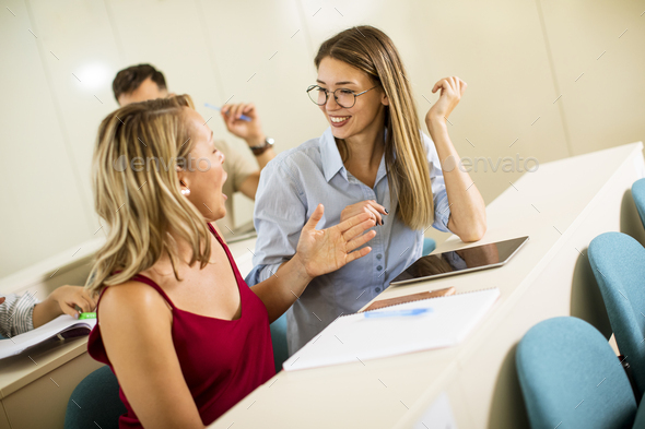University srudents in the classroom Stock Photo by BGStock72 | PhotoDune