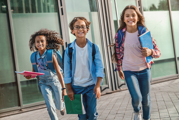 Group of elementary school kids rushing out from school Stock Photo by ...