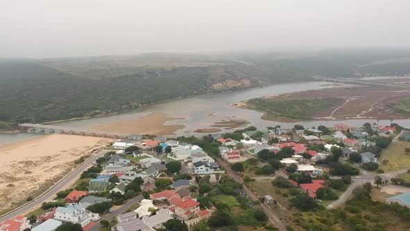 Aerial Pan shot of tropical lagoon draining into ocean, Stock Footage