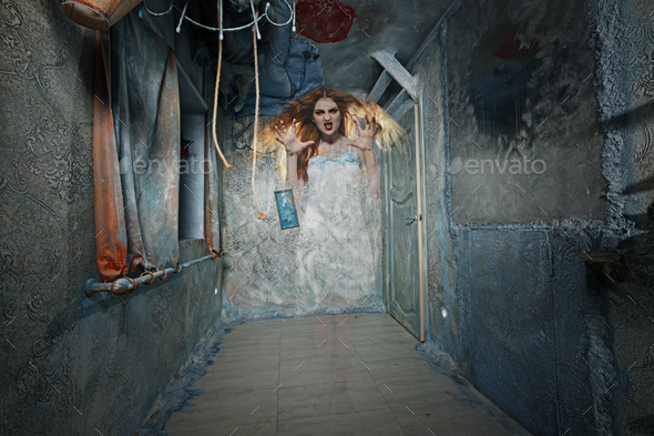 Flying ghost girl stretching hands forward Stock Photo by boomeart