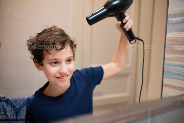 Little boy drying hairs Stock Photo by baffos | PhotoDune