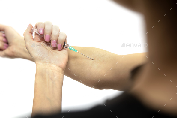 Woman gives her an injection in her hand Stock Photo by BGStock72 ...