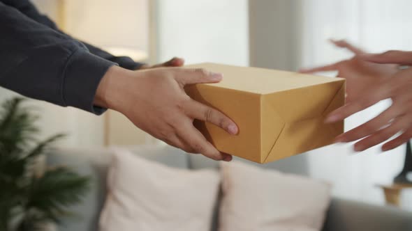 Close up of Asian Woman Hand Receive a parcel cardboard box, Stock Footage