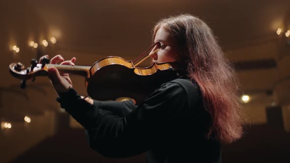 Female Violin Player in Modern Opera House Woman Violinist is Playing ...