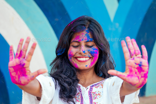 Holi Festival Of Colours. Portrait of happy indian girl in holi color ...