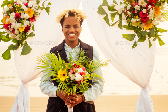 african american female groom in black suit and caucasian bride Stock ...