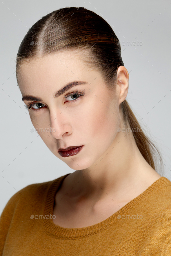 Closeup portrait of fashion model with perfect skin, dark matt lipstick ...