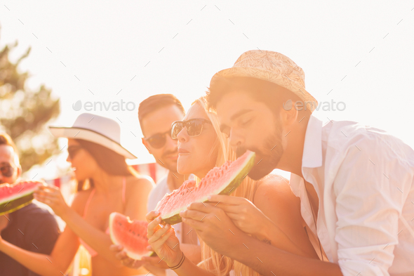 People eating watermelon Stock Photo by Impactphotography | PhotoDune