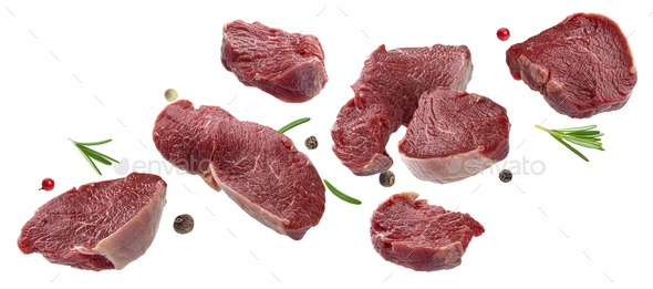 Falling raw beef meat isolated on white background Stock Photo by xamtiw