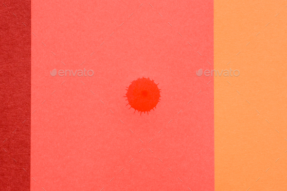 Water drop stain staining a colored paper. Stock Photo by joaquincorbalan