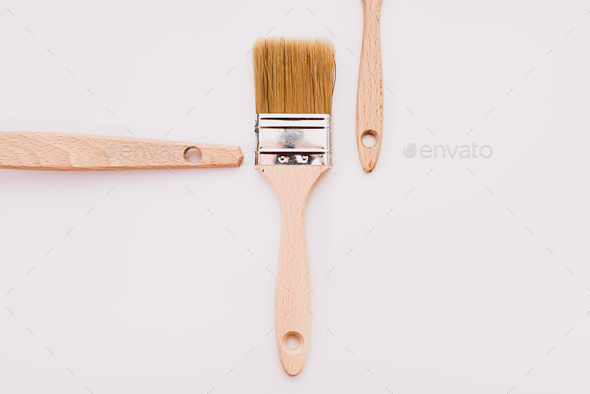 Simple background with new wooden paintbrushes isolated on white studio ...