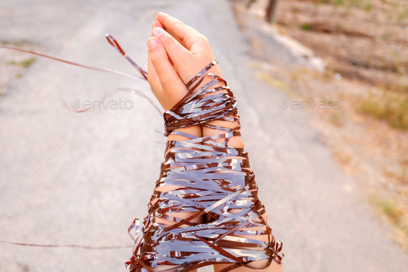 Tied hands, concept of lack of freedom and repression at different ...