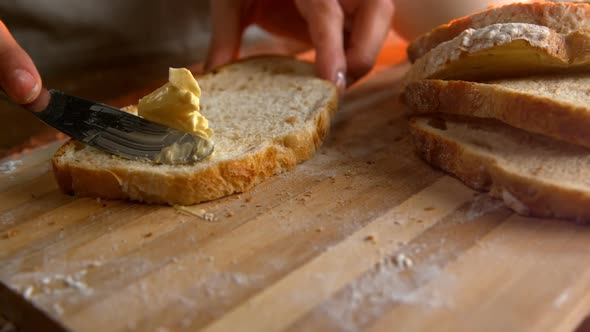 Woman applying butter on bread 4k, Stock Footage | VideoHive