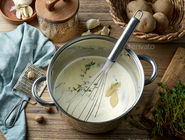 pot with hot mixed milk cream and herbs Stock Photo by magone | PhotoDune
