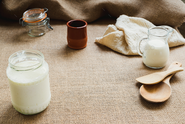 Milk kefir prepared at home, process of separating the grains from the ...