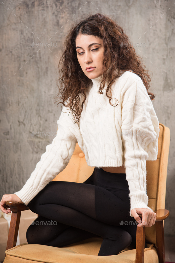 Photo of attractive lady sitting in comfy chair and posing Stock Photo ...