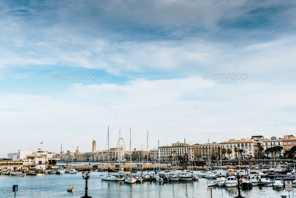 Sunset view of the touristic seafront and port of Bari, with its ferris ...
