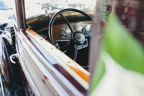 Dashboard of an old vintage car seen from the outside window. Stock ...