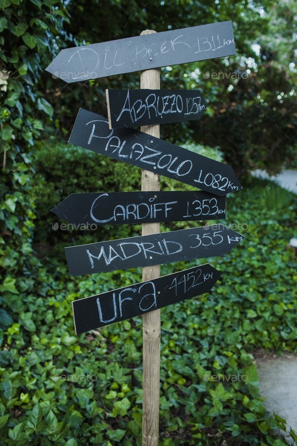 Wooden signposts at events and weddings Stock Photo by joaquincorbalan