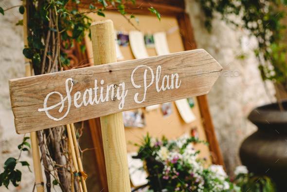 Wooden signposts at events and weddings Stock Photo by joaquincorbalan