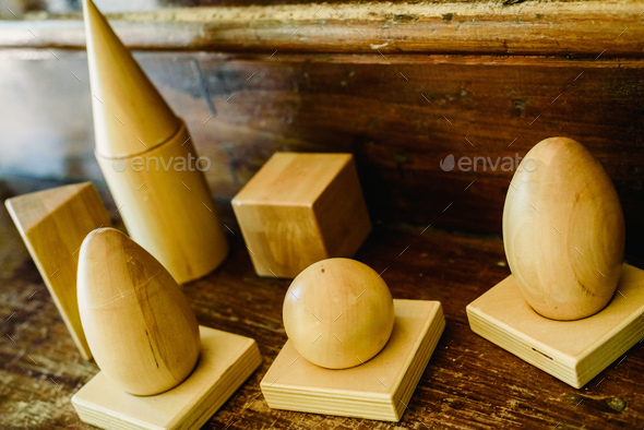Solid wood shapes to study geometry and volumes, cones, triangles ...