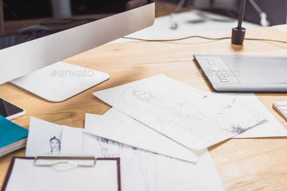 Work table of designer with sketches and computer Stock Photo by ...