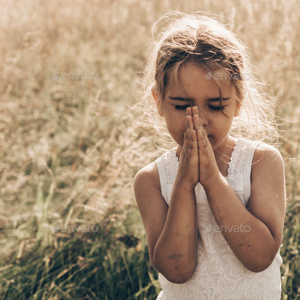 Little girl praying Stock Photo by StiahailoAnastasiia | PhotoDune