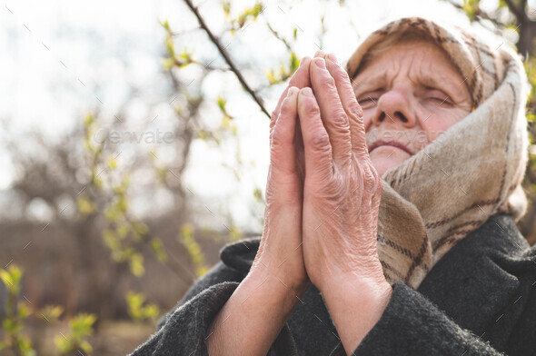 grandmother is praying Stock Photo by StiahailoAnastasiia | PhotoDune