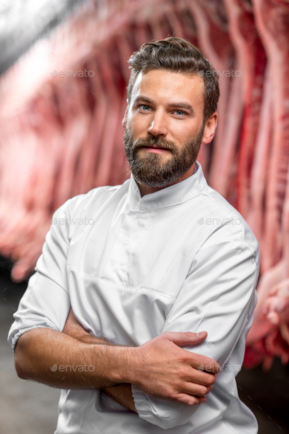 Portrait of a handsome butcher at the manufacturing Stock Photo by ...
