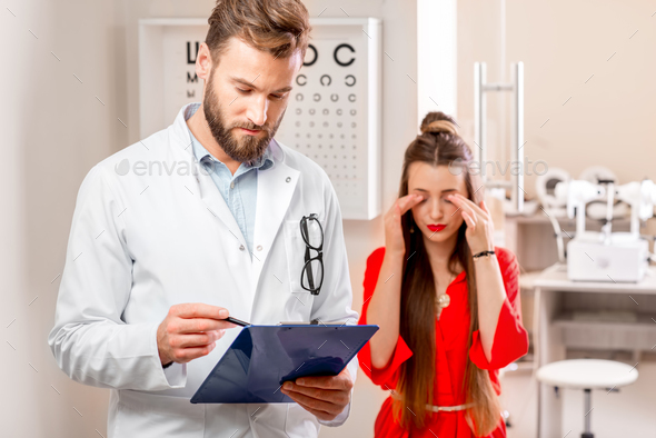 Eye doctor with unhappy patient Stock Photo by RossHelen | PhotoDune