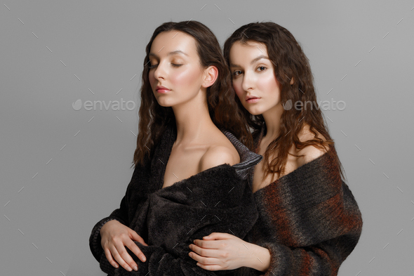 young fashion twins. sister embosom her sister Stock Photo by boomeart