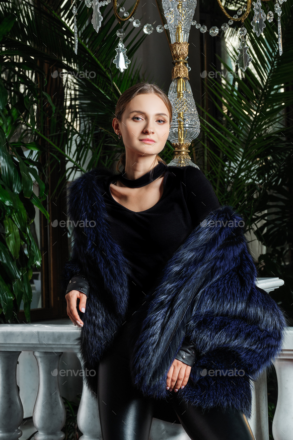 Beautiful fashion model posing in fur coat Stock Photo by boomeart