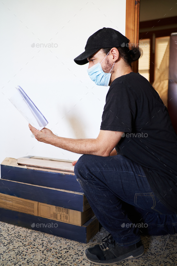 Hispanic man with mas reading user manual Stock Photo by daniskim ...