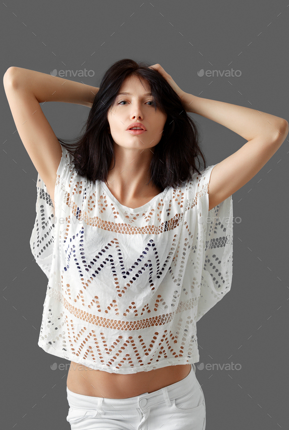 beautiful fashion model posing on grey background Stock Photo by boomeart