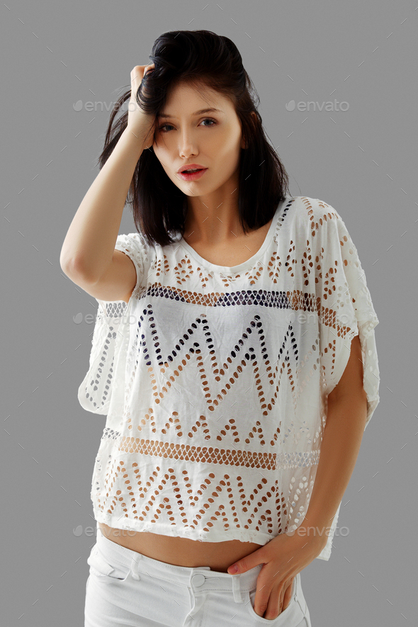 beautiful fashion model posing on grey background Stock Photo by boomeart