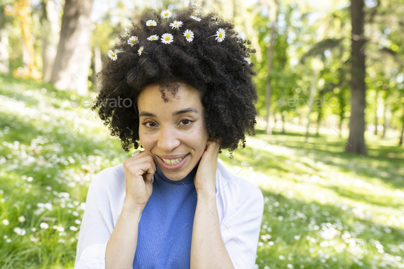 pretty afro woman, with flowers in her hair, afro hairstyle, spring ...