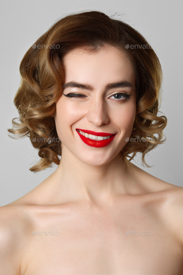 Close up portrait of pretty winking girl Cosmetics concept. Stock Photo ...