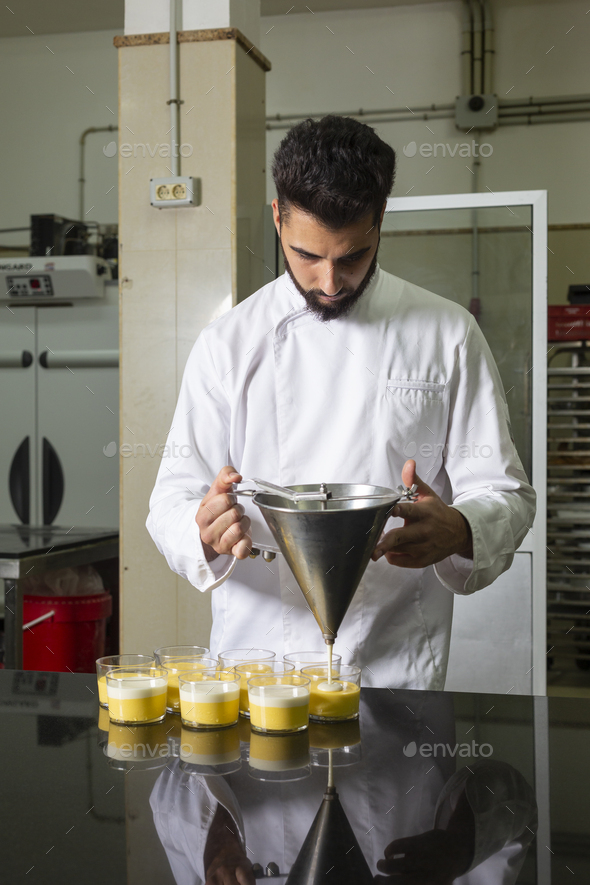 Pastry chef working dosing the desserts in glass. Stock Photo by ...