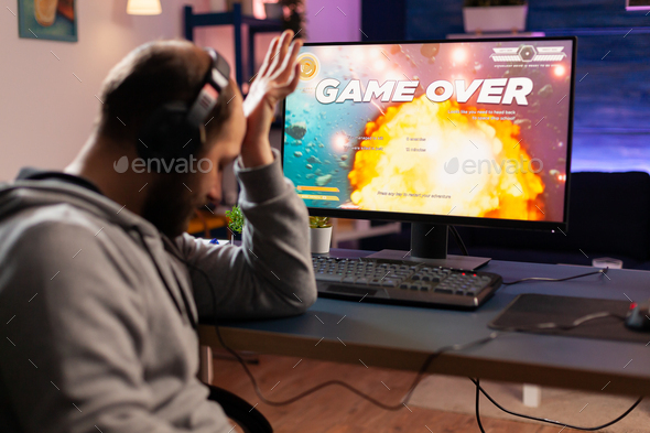 Portrait of sad upset gamer because he lost at video game Stock Photo ...