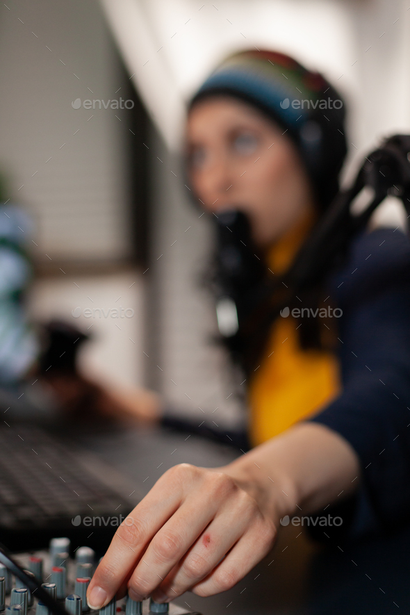 Close up of streamer wearing headset and talking into microphone Stock ...