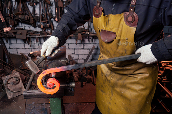 handsome african american blacksmith male worker working in workshop ...
