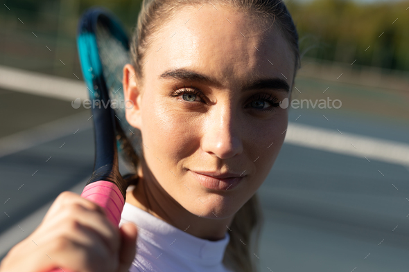 Close-up portrait of beautiful young caucasian female tennis player ...