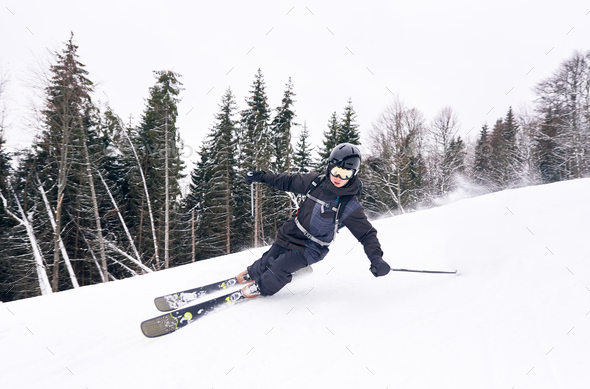 Skiing down from high mountain. Skier making unlucky maneuver on ...