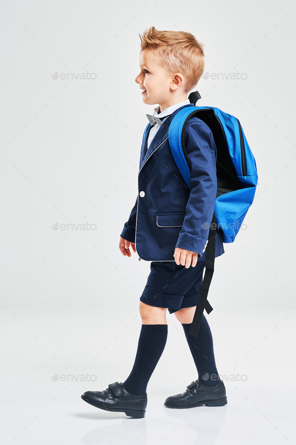 Portrait of a boy ready to school isolated on white Stock Photo by macniak